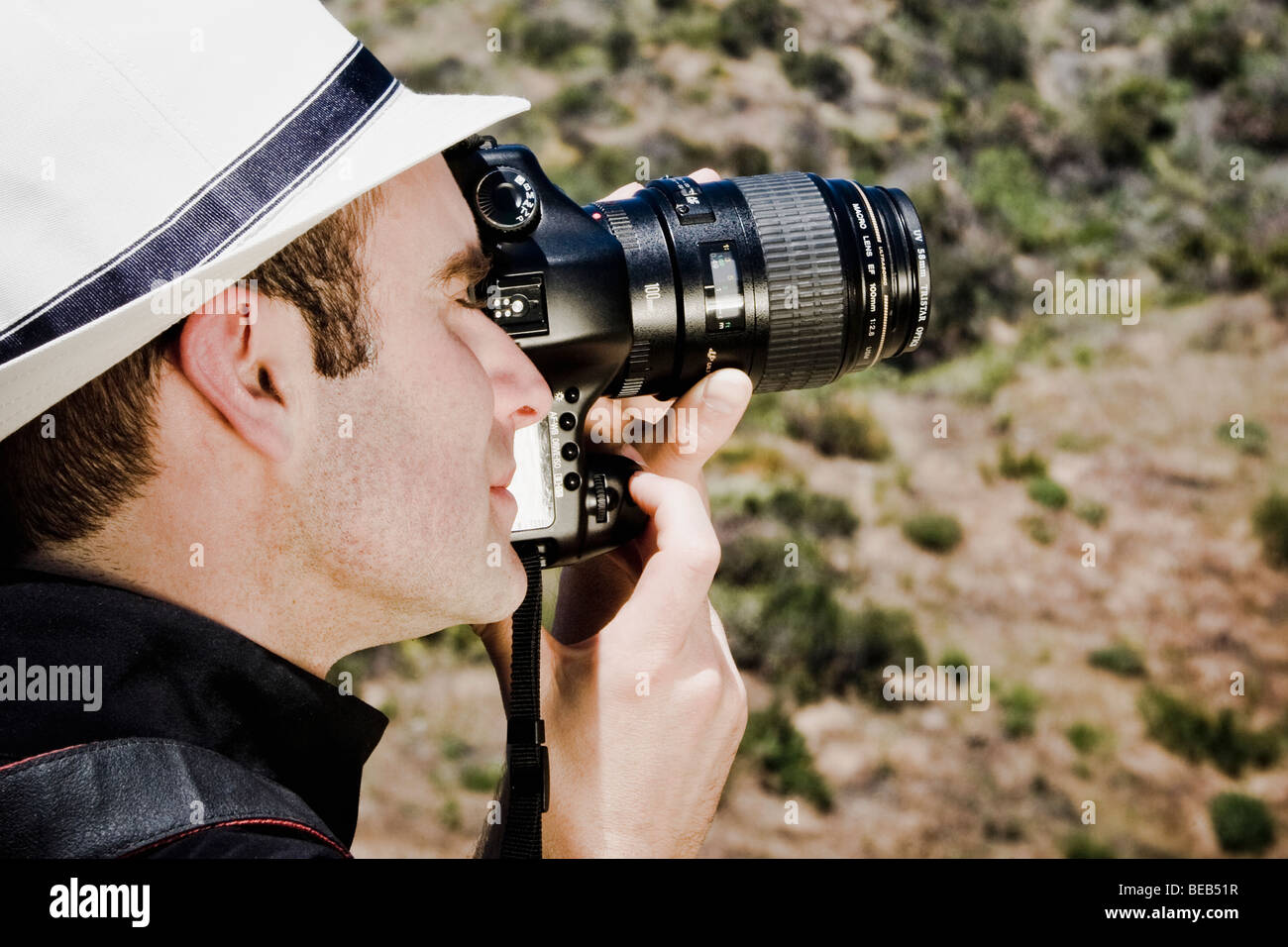 Close-up of a man taking a picture with a camera, Hollywood Hills ...