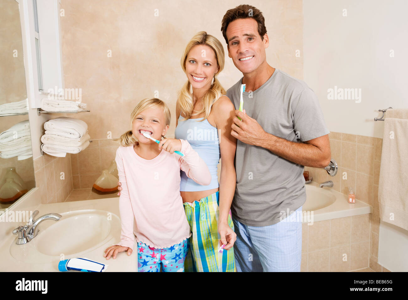 Family brushing teeth in the bathroom Stock Photo - Alamy