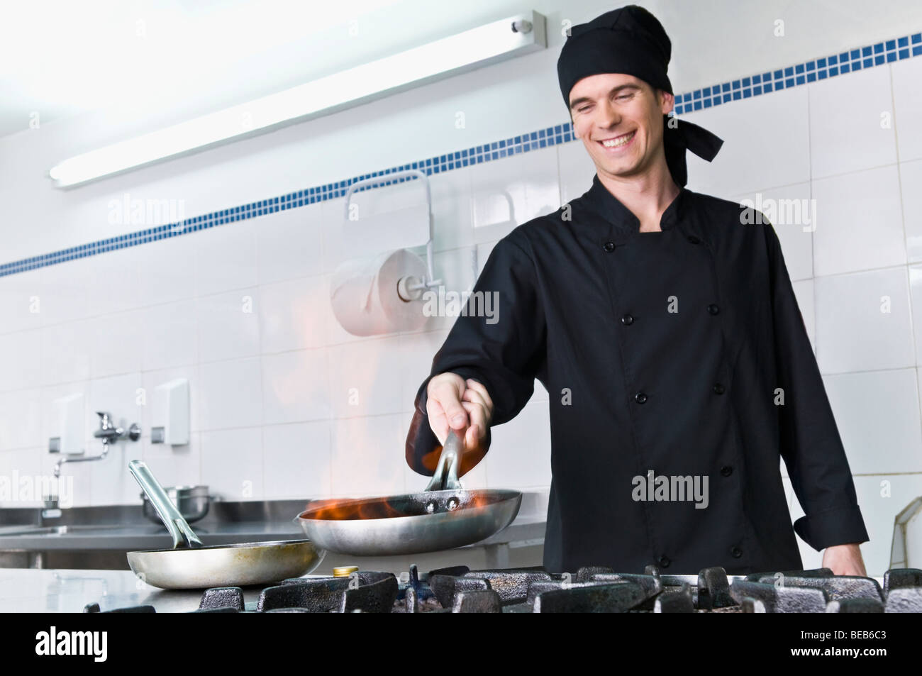 Chef cooking food Stock Photo - Alamy