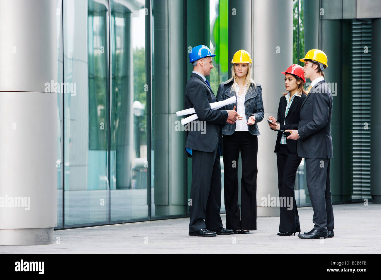 Team of construction managers visiting a property development Stock ...