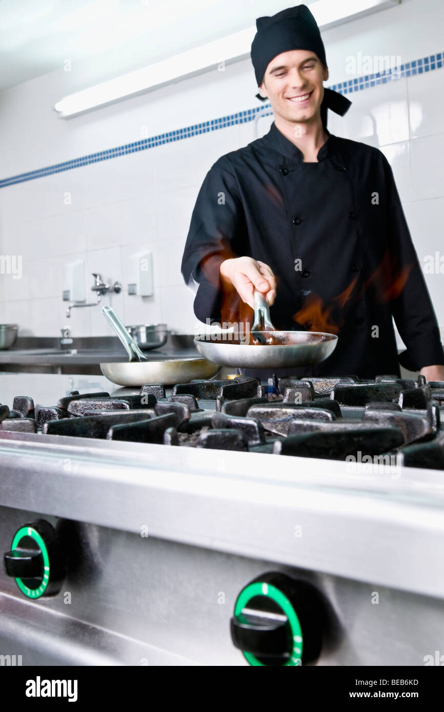 Chef cooking food Stock Photo - Alamy