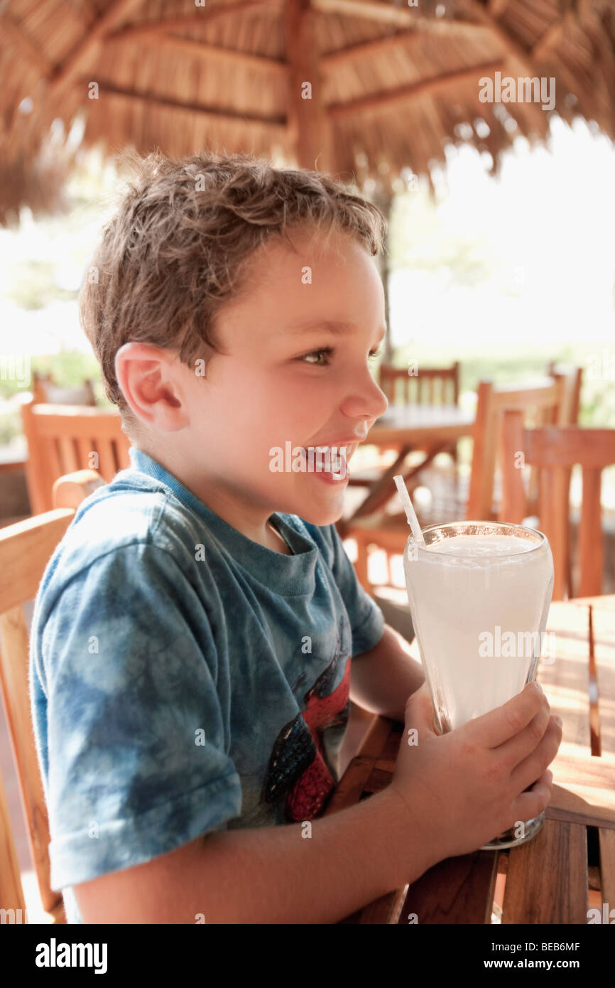 Boy drinking lemonade and smiling Stock Photo - Alamy