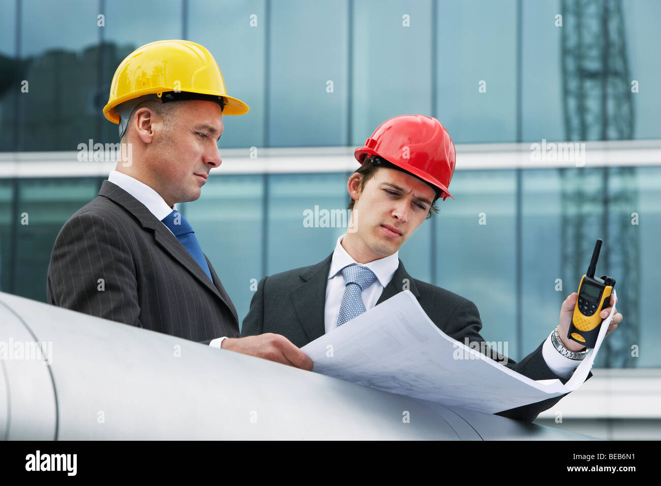 Construction managers with plans Stock Photo - Alamy