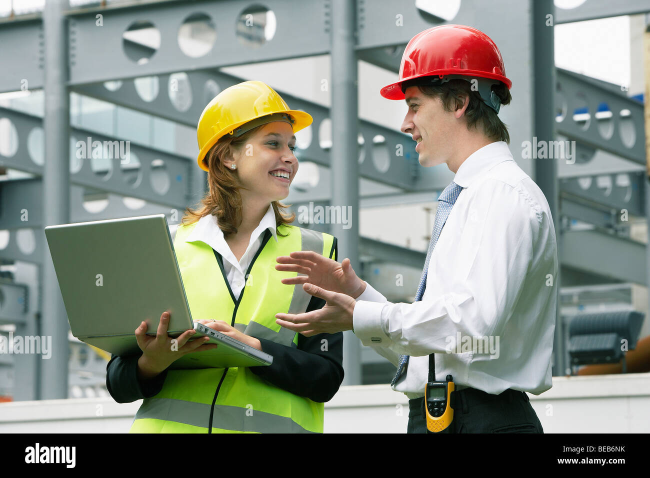 Construction managers on site with computer Stock Photo - Alamy