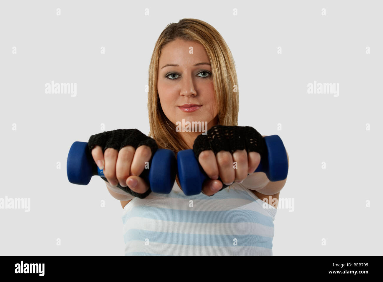 Woman with hand weights Stock Photo - Alamy
