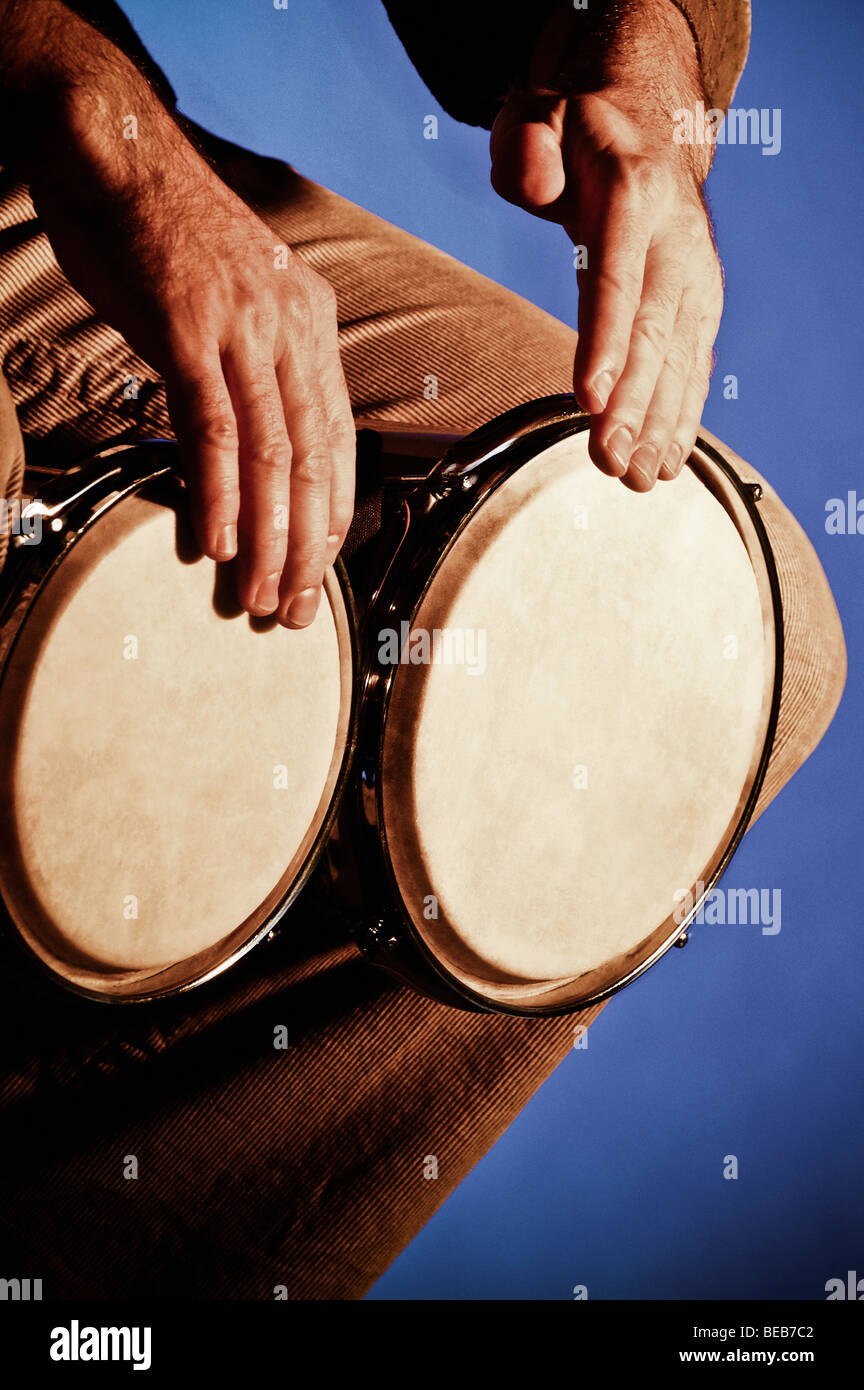 Close-up of a man playing a bongo Stock Photo - Alamy