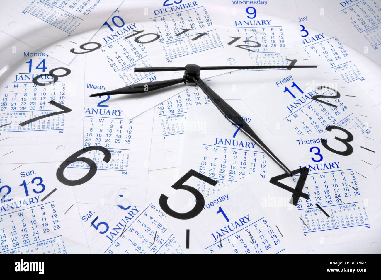 Calendar Pages and Clock Stock Photo - Alamy