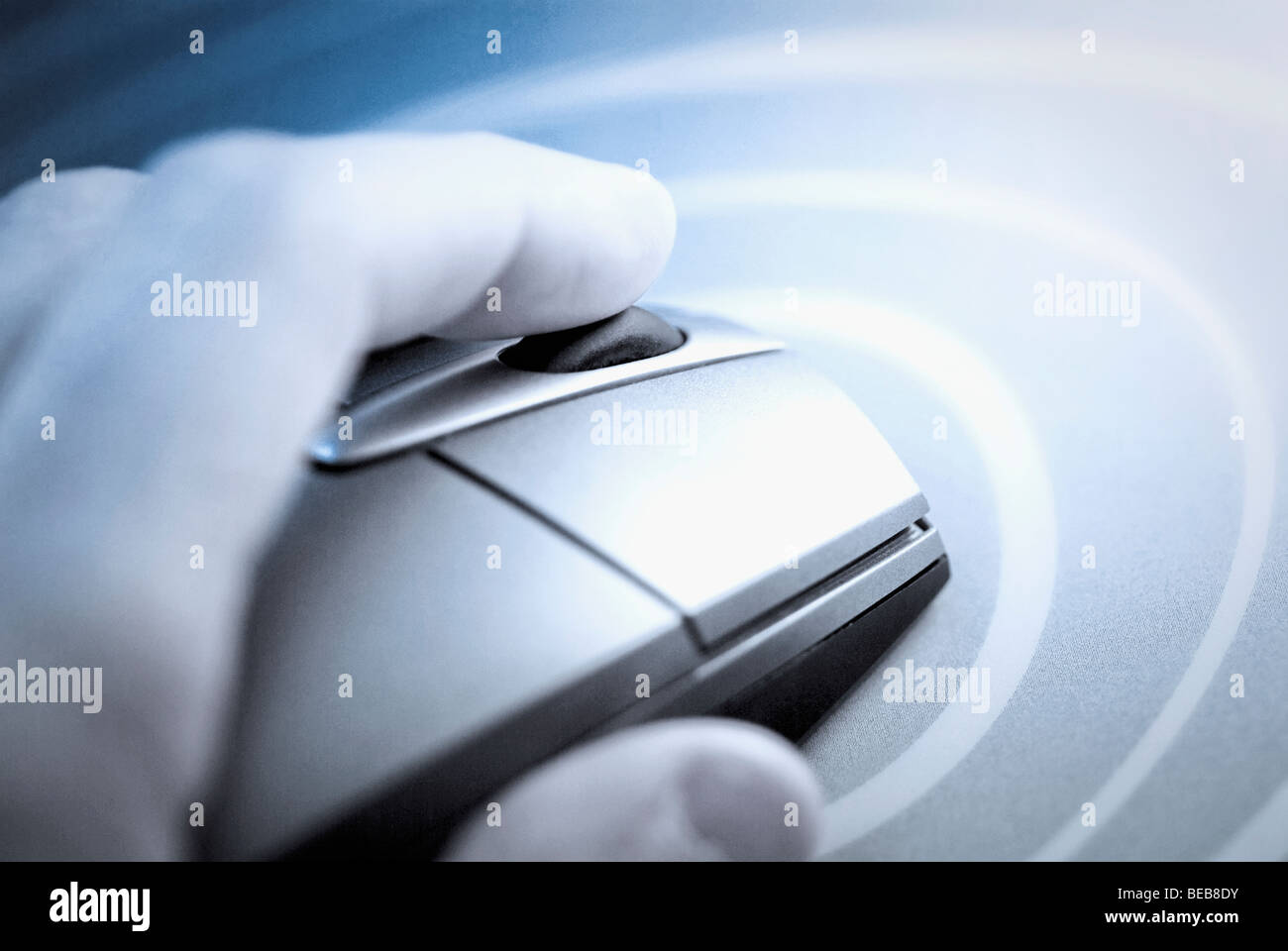 Close-up of a human hand holding a computer mouse Stock Photo - Alamy