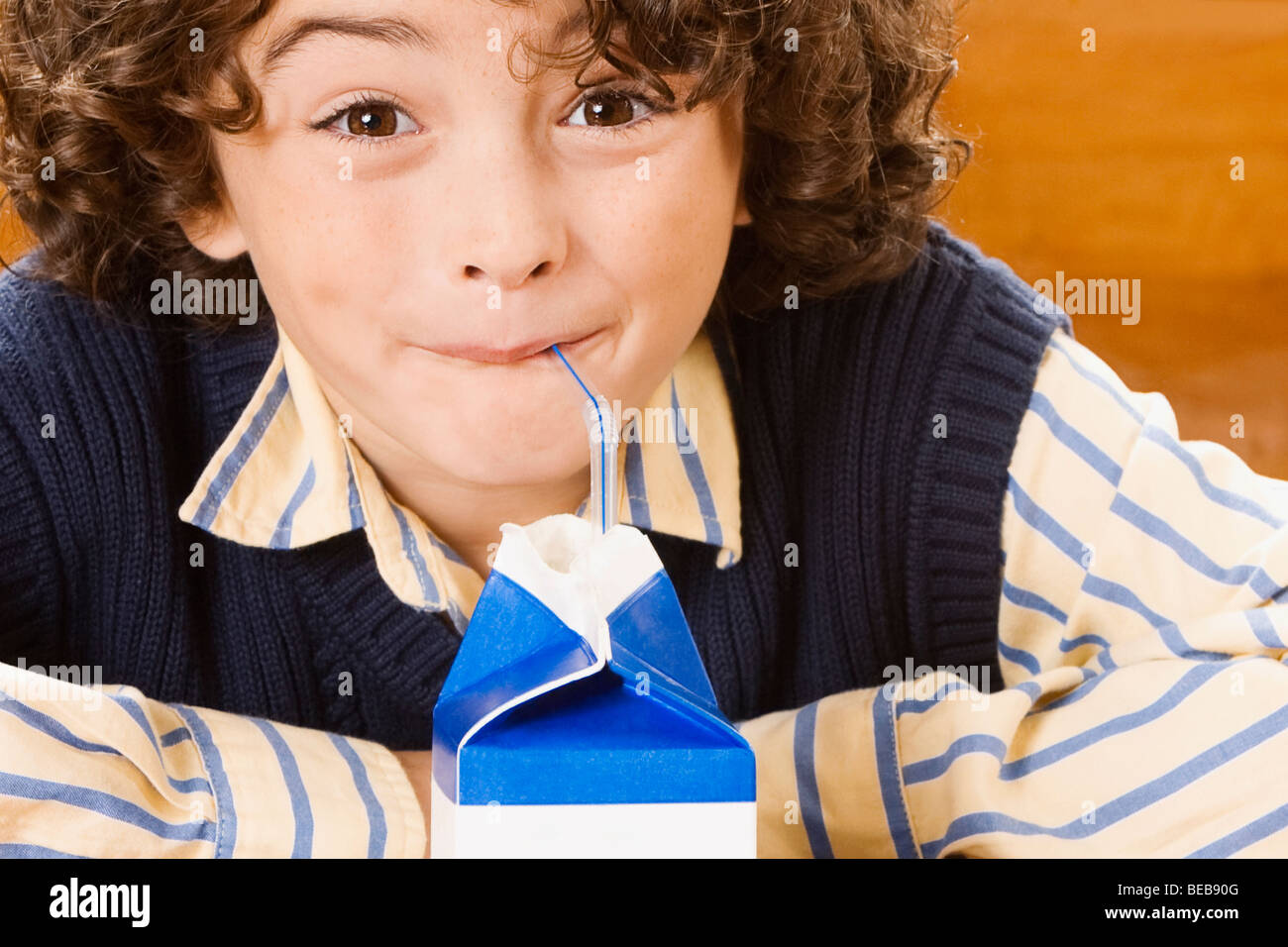 Schoolboy drinking juice in a classroom Stock Photo - Alamy