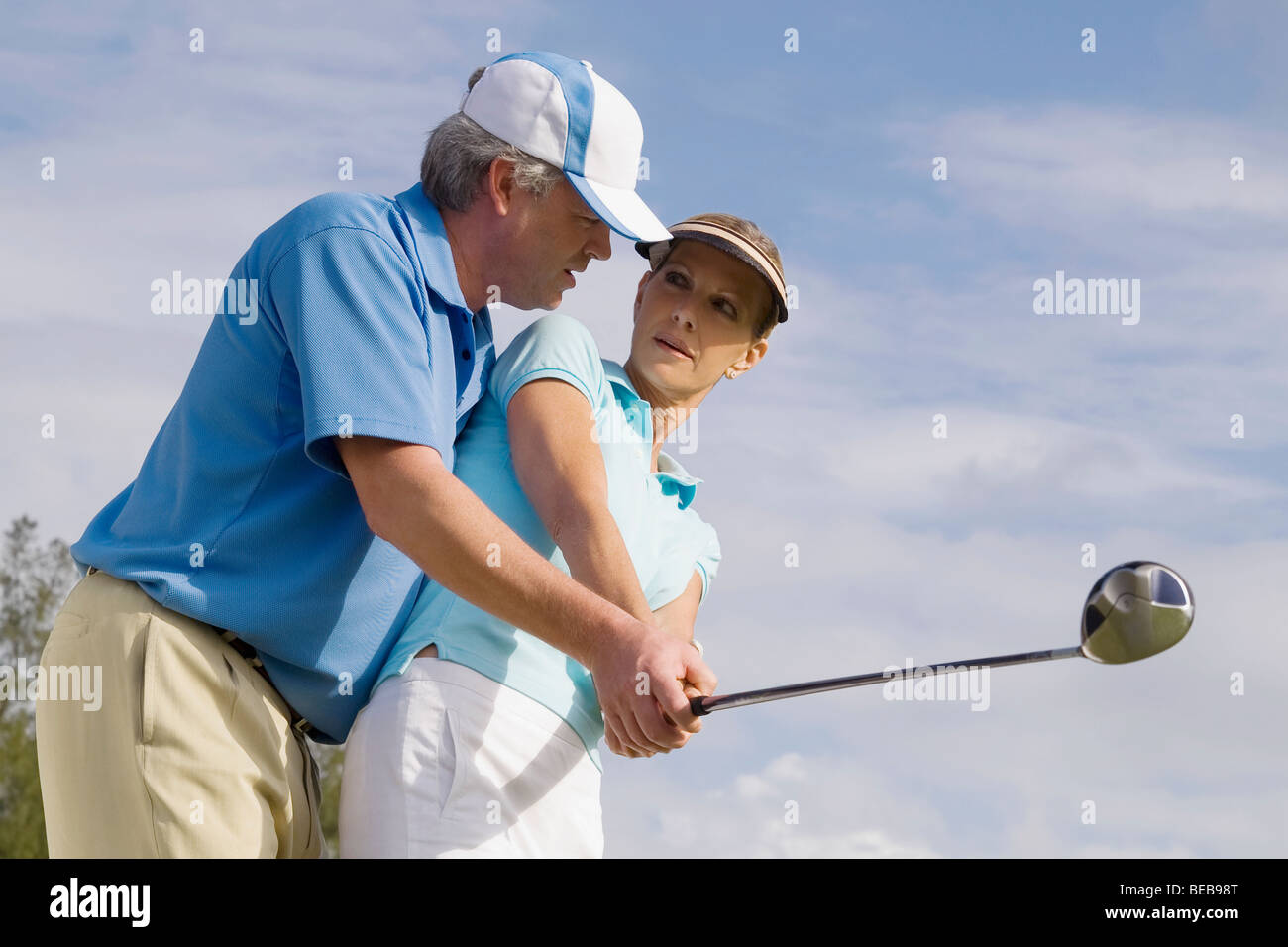 Side view woman playing golf hi-res stock photography and images - Alamy