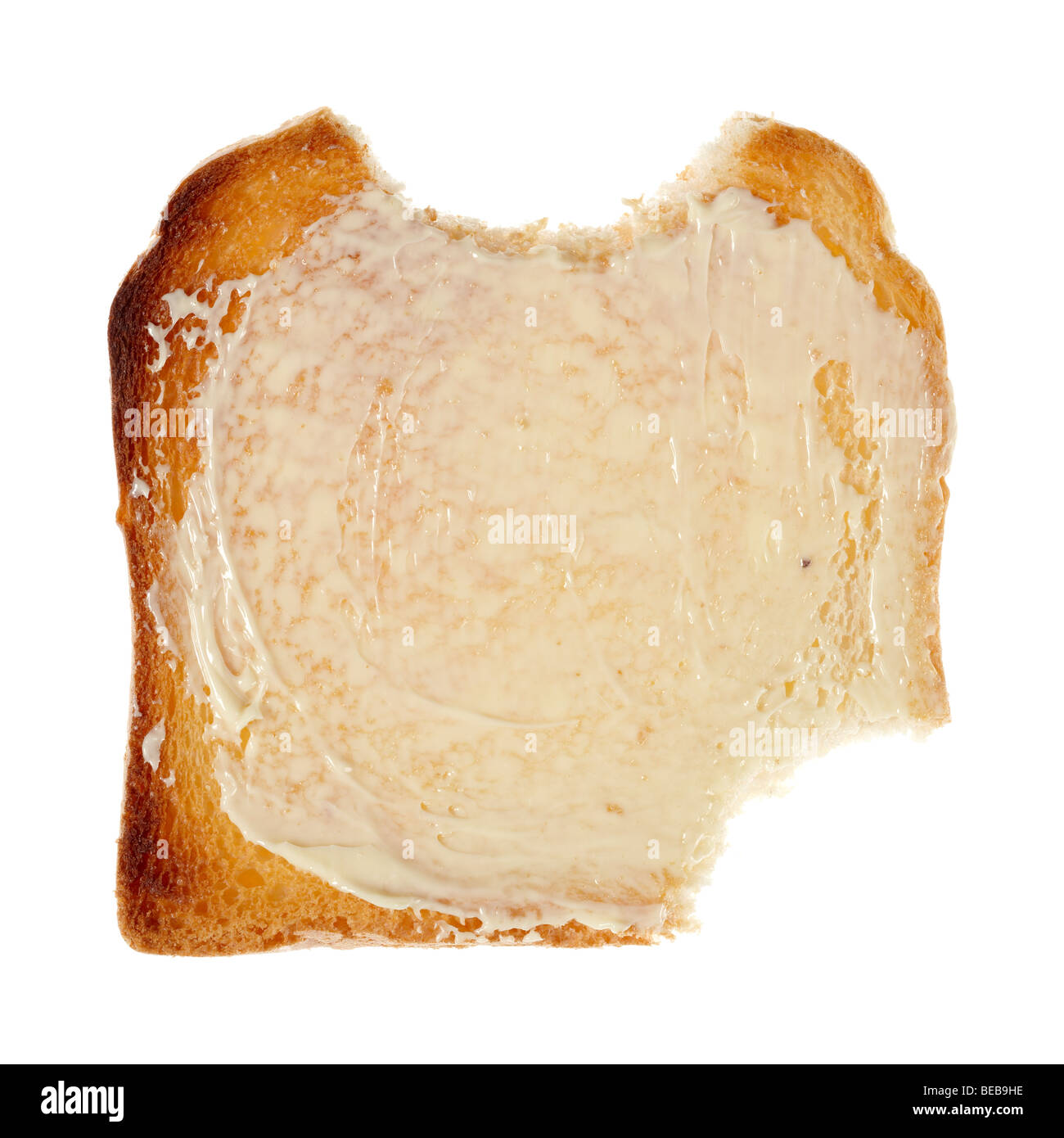 Buttered toast with two bites missing Stock Photo - Alamy
