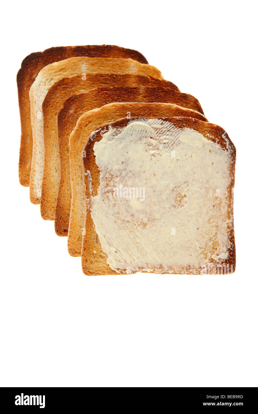 Stacked toasts, one buttered Stock Photo - Alamy