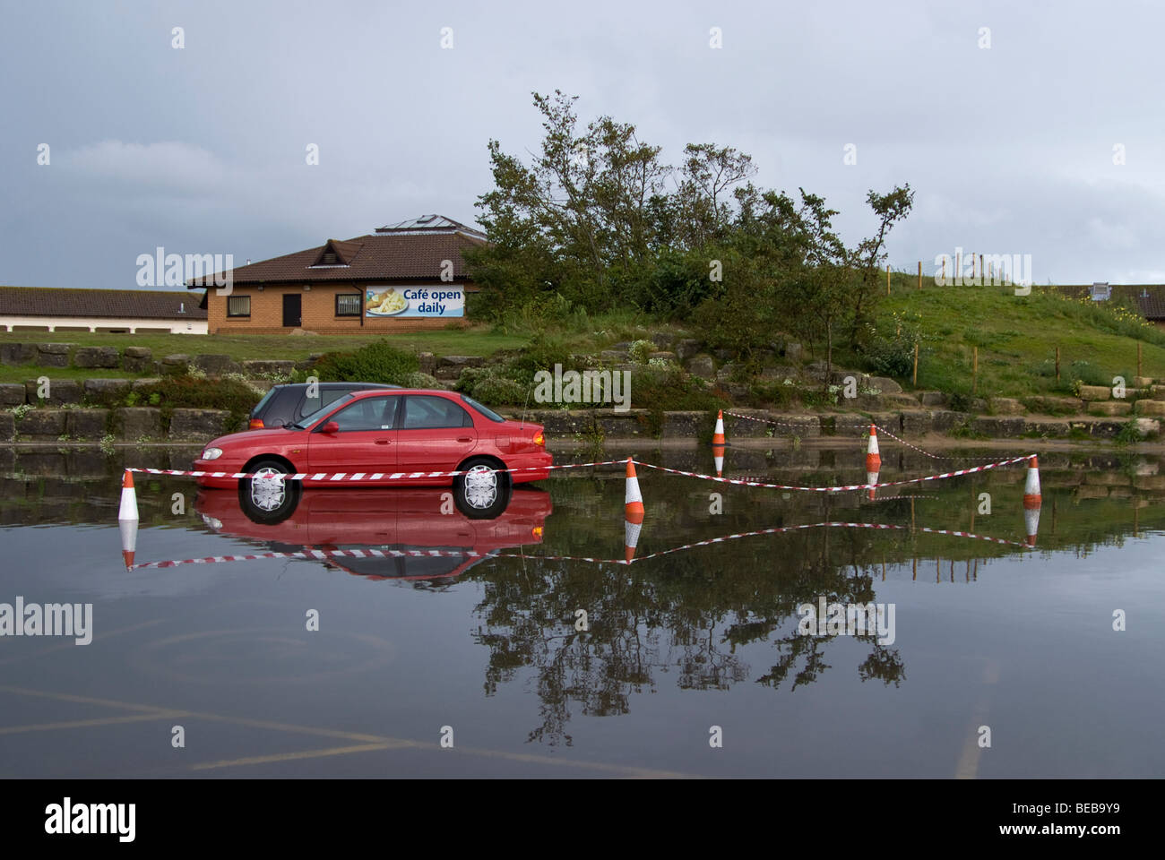 Cars in a flooded beach car park at Sandbanks, Poole Stock Photo - Alamy