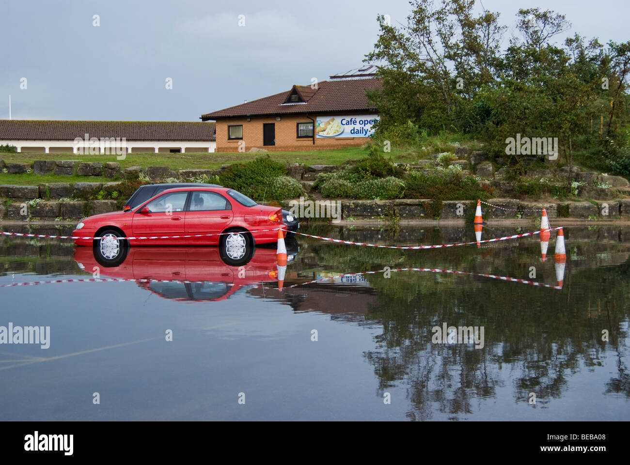 Cars in a flooded beach car park at Sandbanks, Poole Stock Photo - Alamy