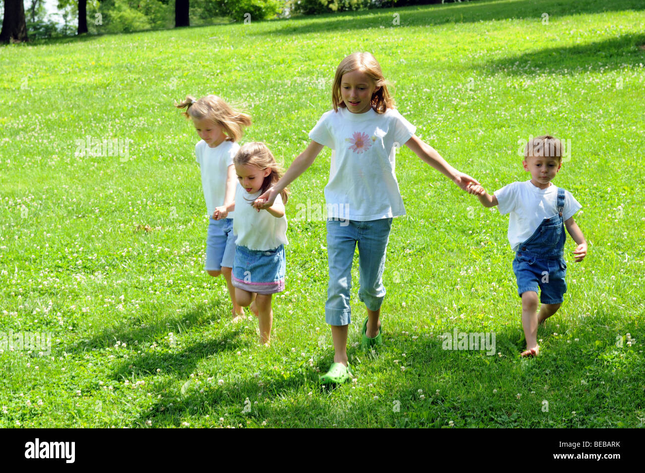 Children Holding Hands And Running Together Stock Photo Alamy children-holding-hands-and-running-together-stock-photo-alamy