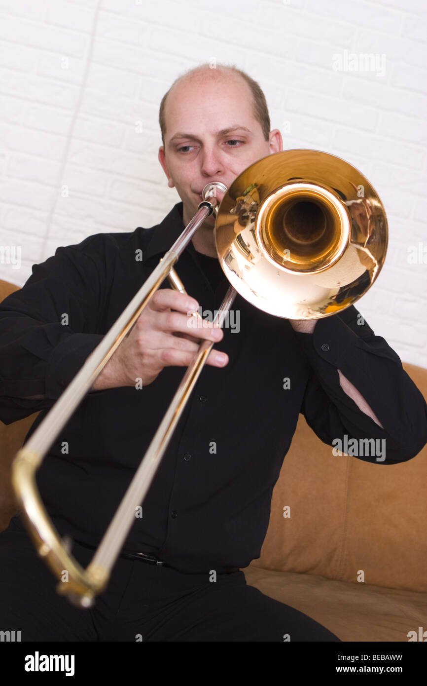 Man playing brass instrument hi-res stock photography and images - Alamy