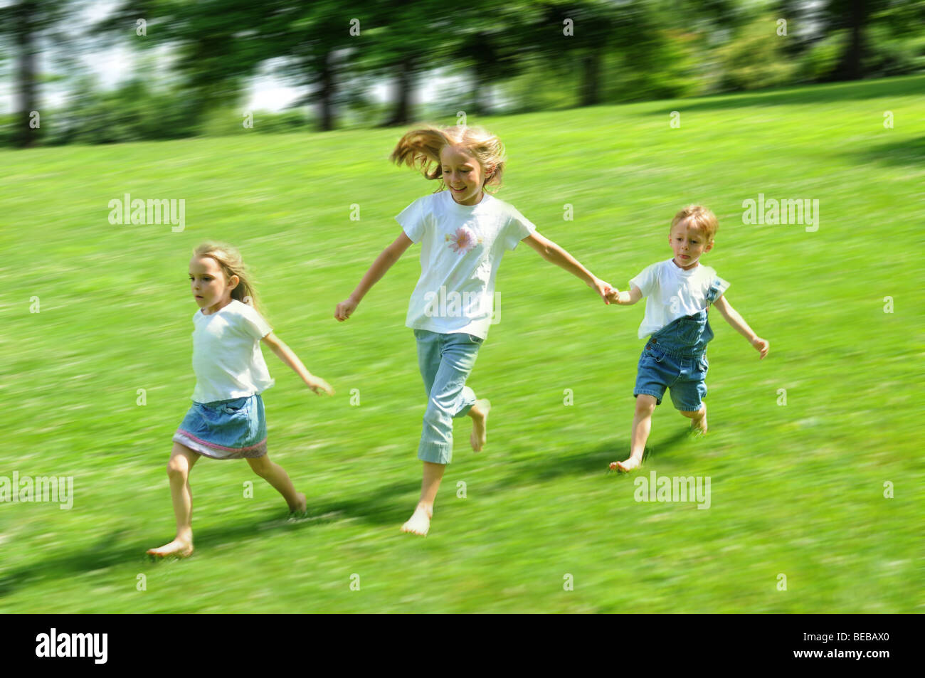 Children running with background motion blur Stock Photo - Alamy