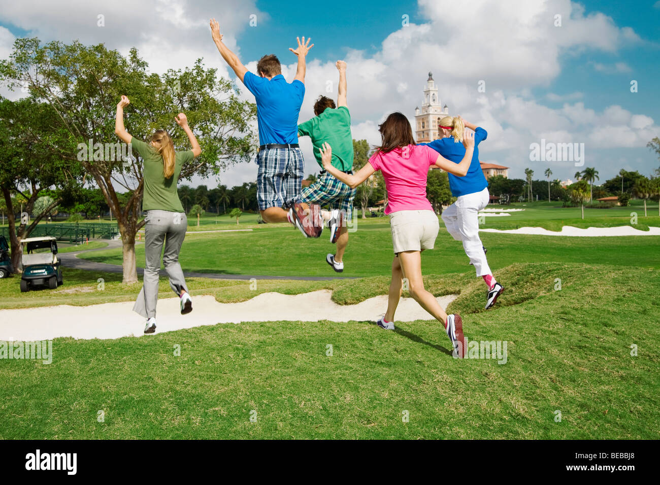 Five friends having fun in a golf course, Biltmore Golf Course, Coral ...