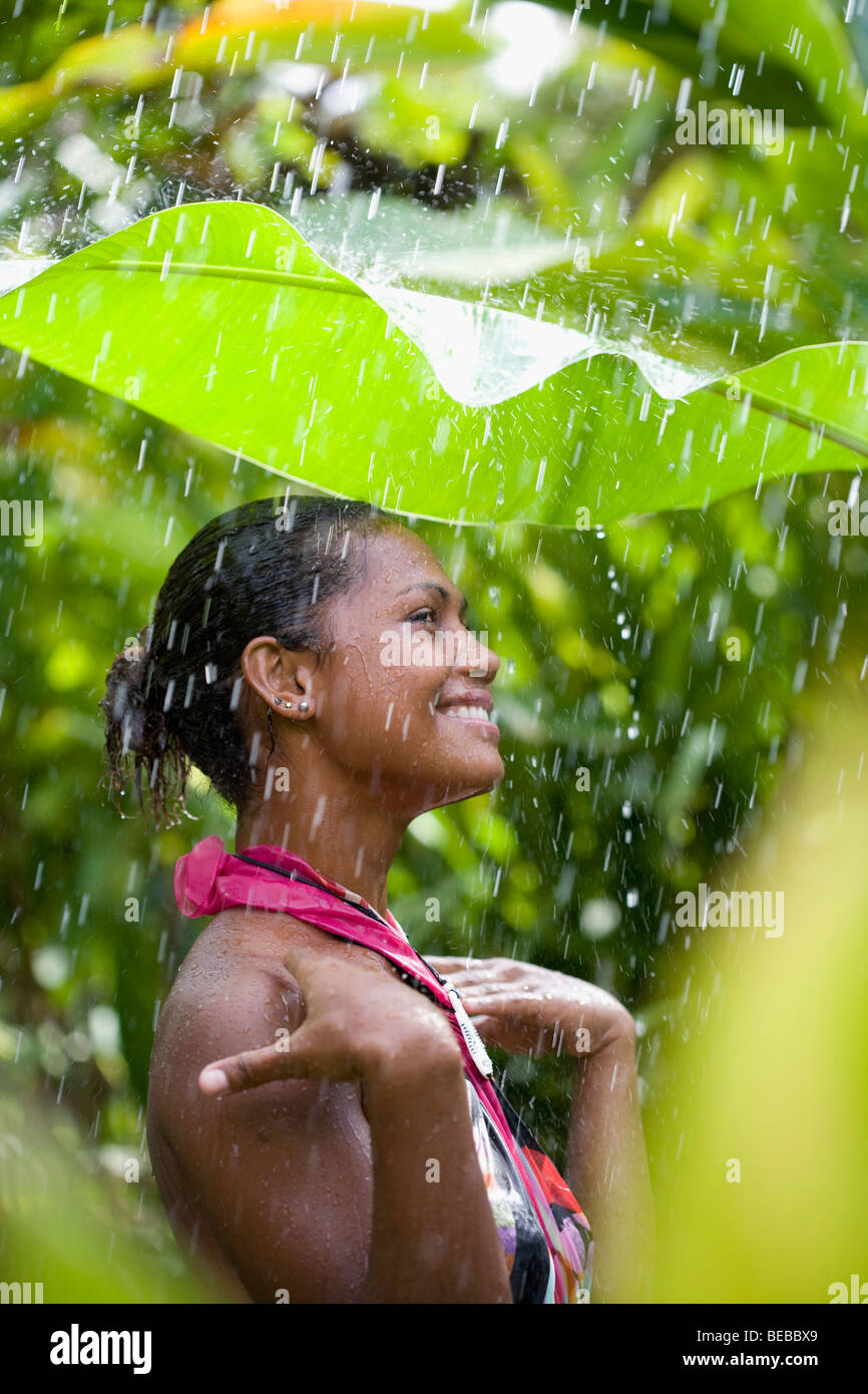 Close-up of a woman enjoying rain shower Stock Photo - Alamy