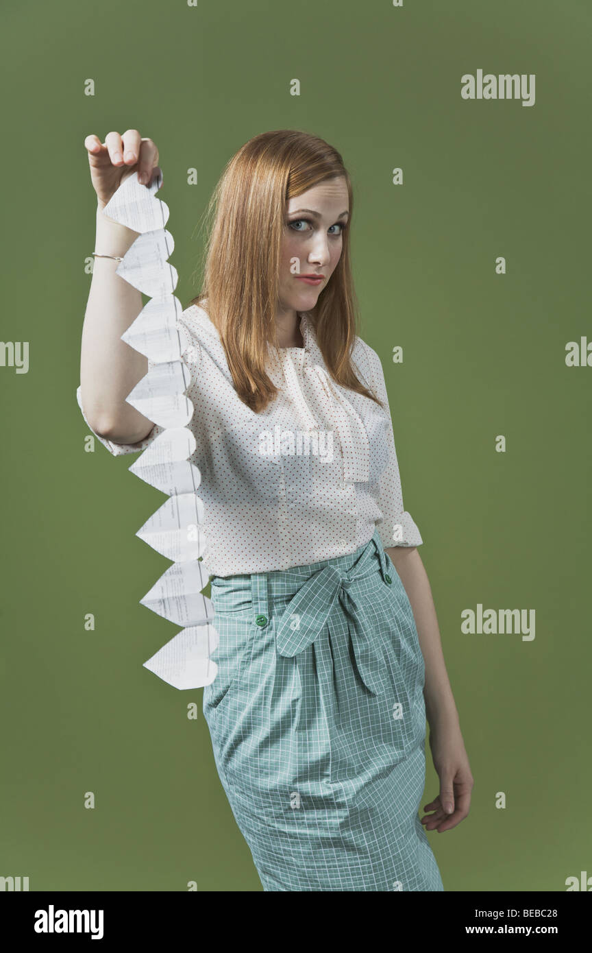 Portrait of a woman holding a heart shaped paper chain Stock Photo - Alamy