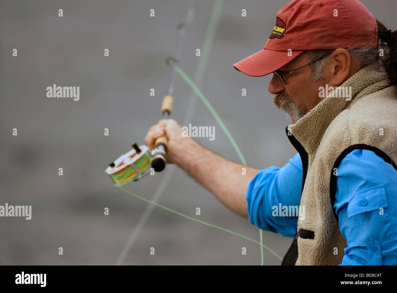 Fisherman Dave Felce casting a fly fishing rod into the sea off the ...