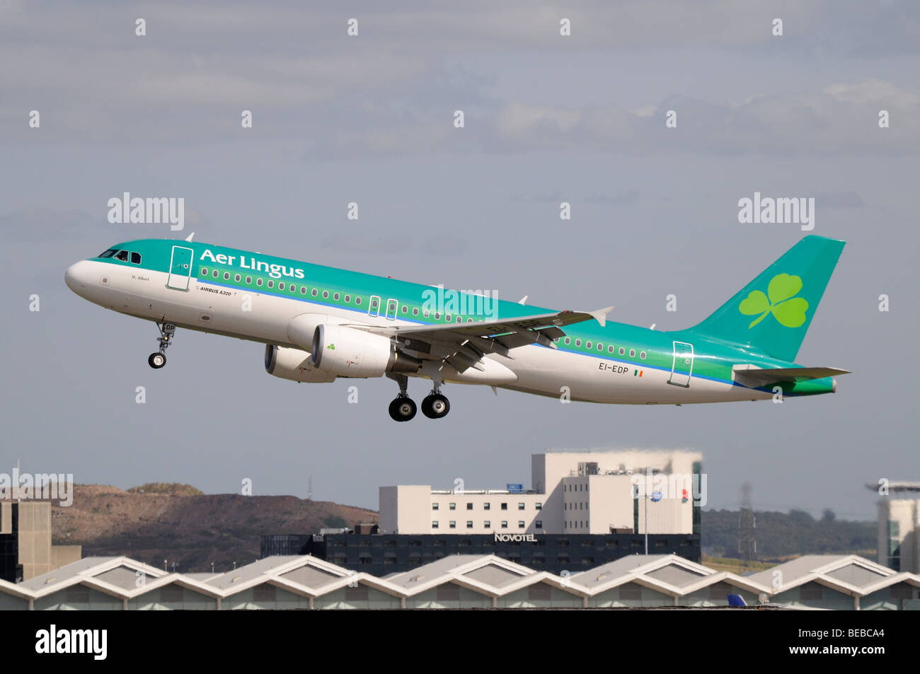 side view of Aer Lingus Airbus A320 aeroplane taking off from ...