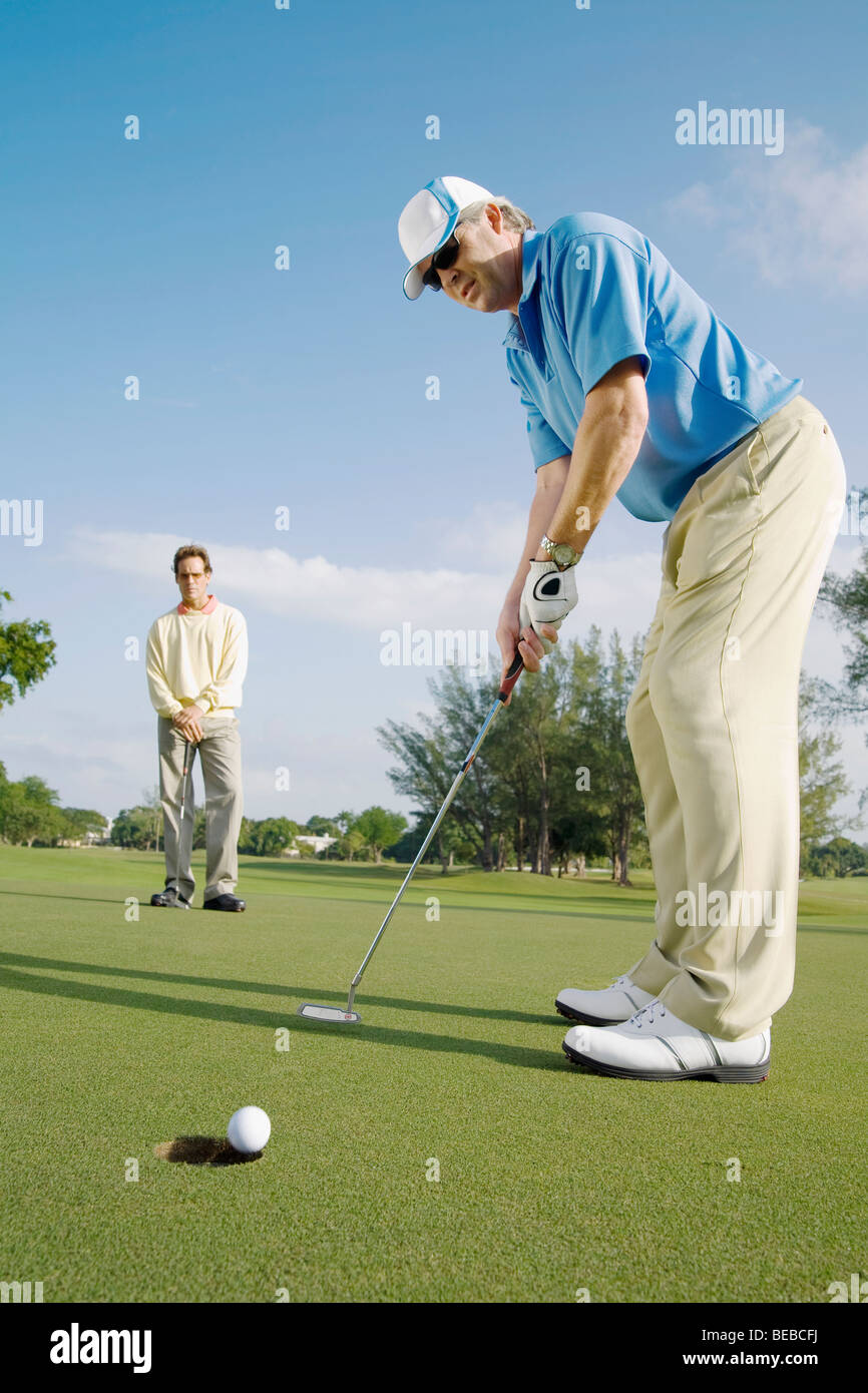 Two golfer playing golf in a golf course, Biltmore Golf Course, Coral ...