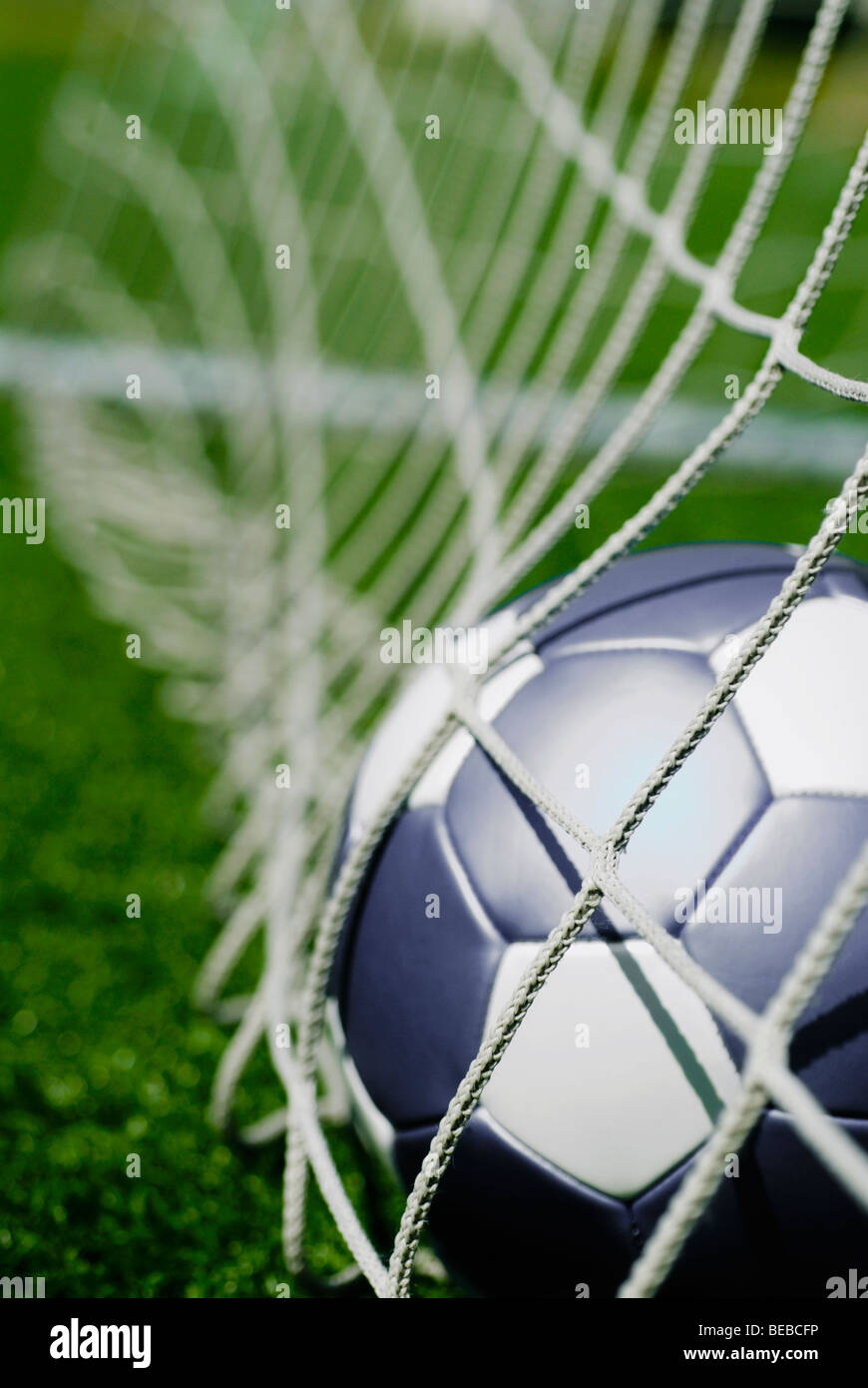 Close-up of a soccer ball in the net Stock Photo - Alamy