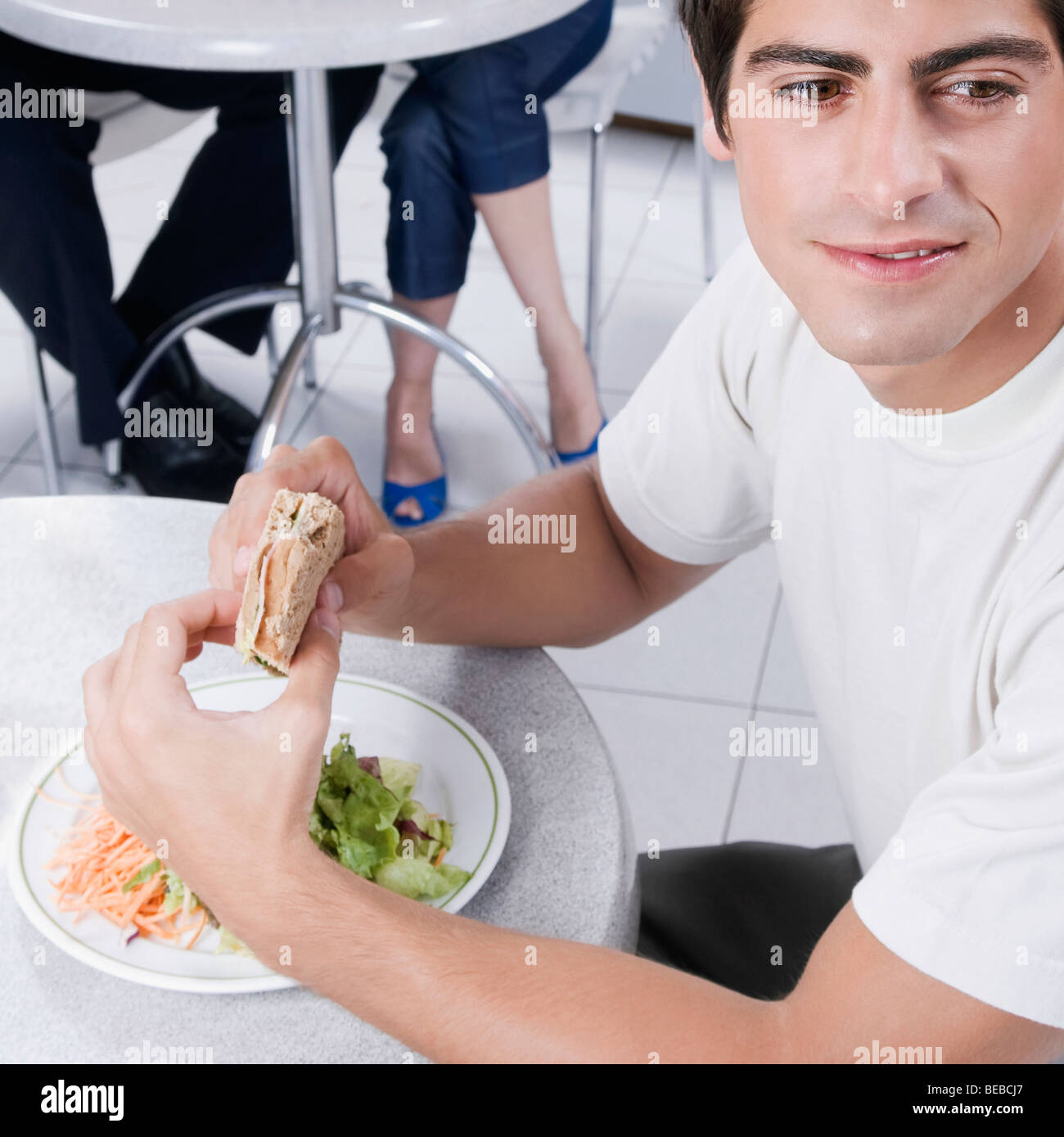 Man eating a sandwich Stock Photo - Alamy