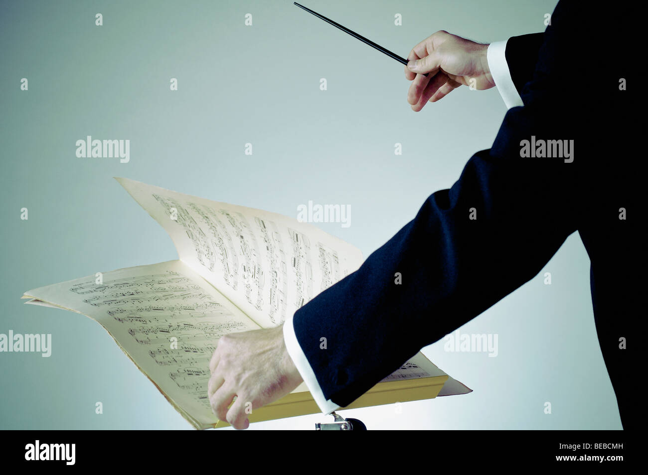 Mid section view of a music conductor performing Stock Photo - Alamy