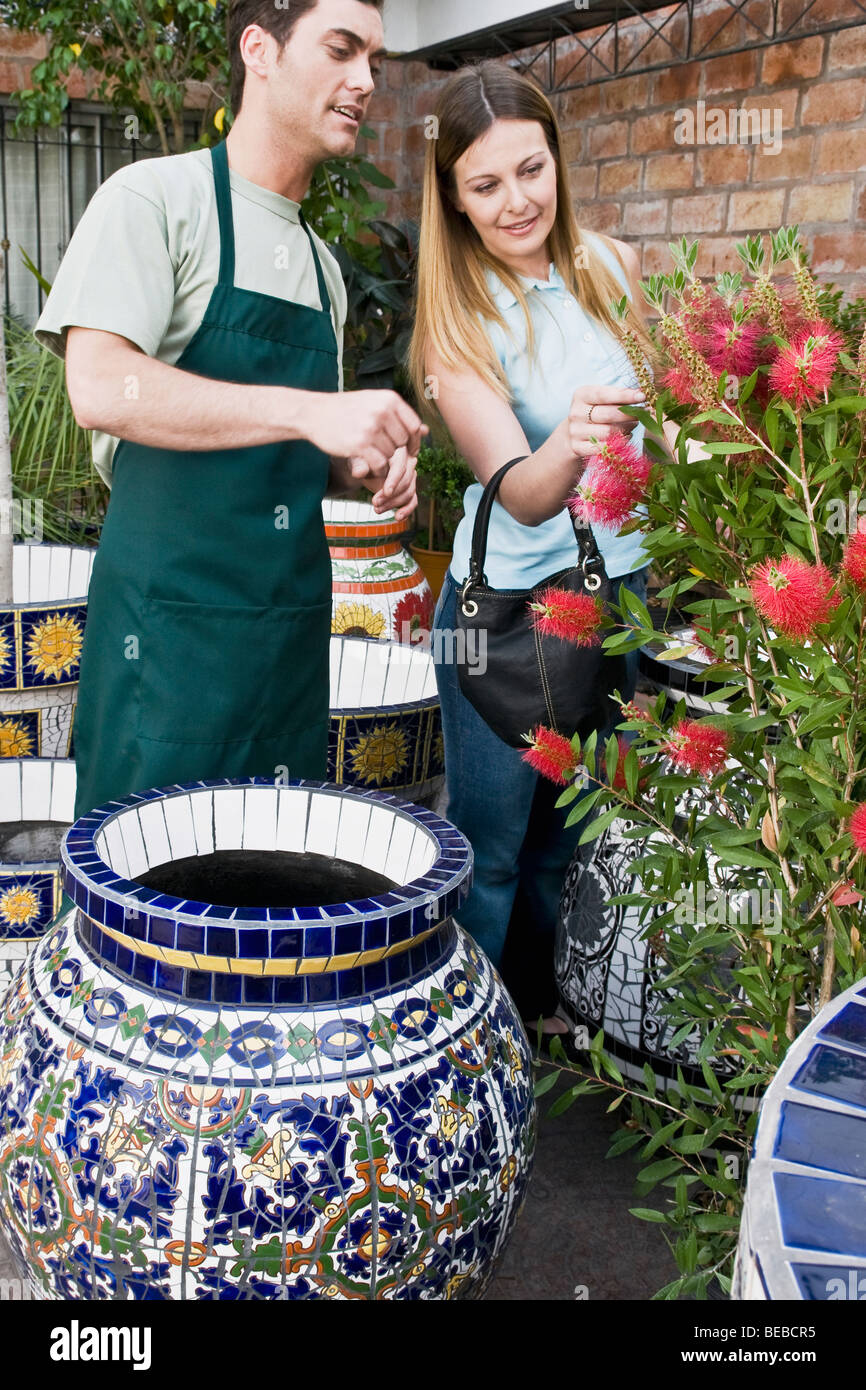 Customer buying a decorative urn Stock Photo - Alamy