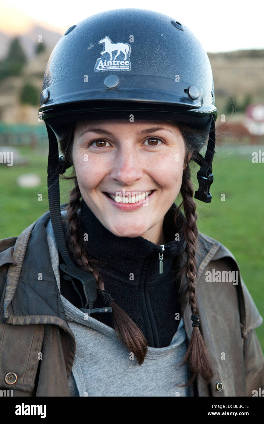 Portrait of a young woman wearing a riding helmet Stock Photo - Alamy