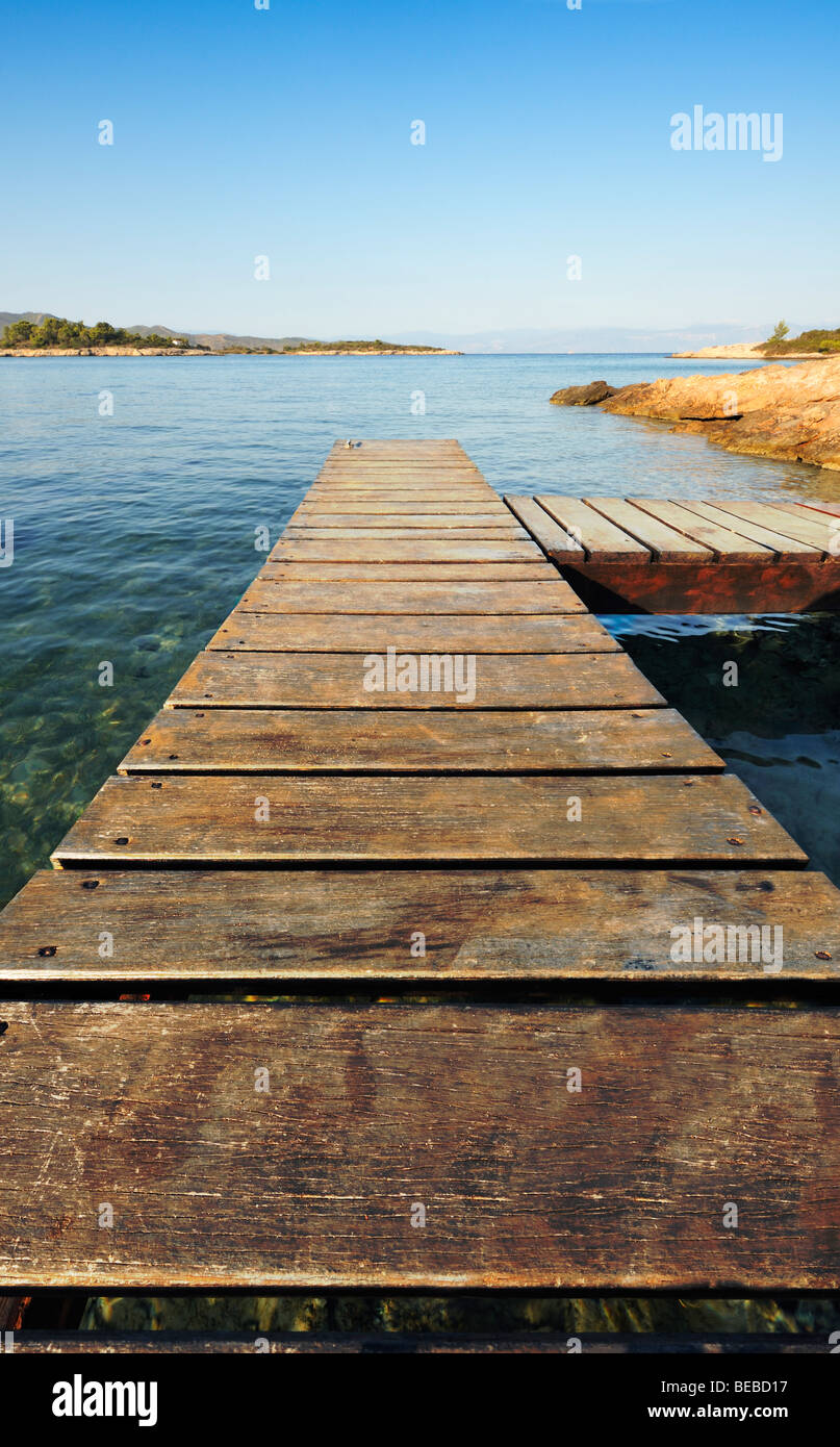 Wooden pier in Greece extending into the sea Stock Photo - Alamy