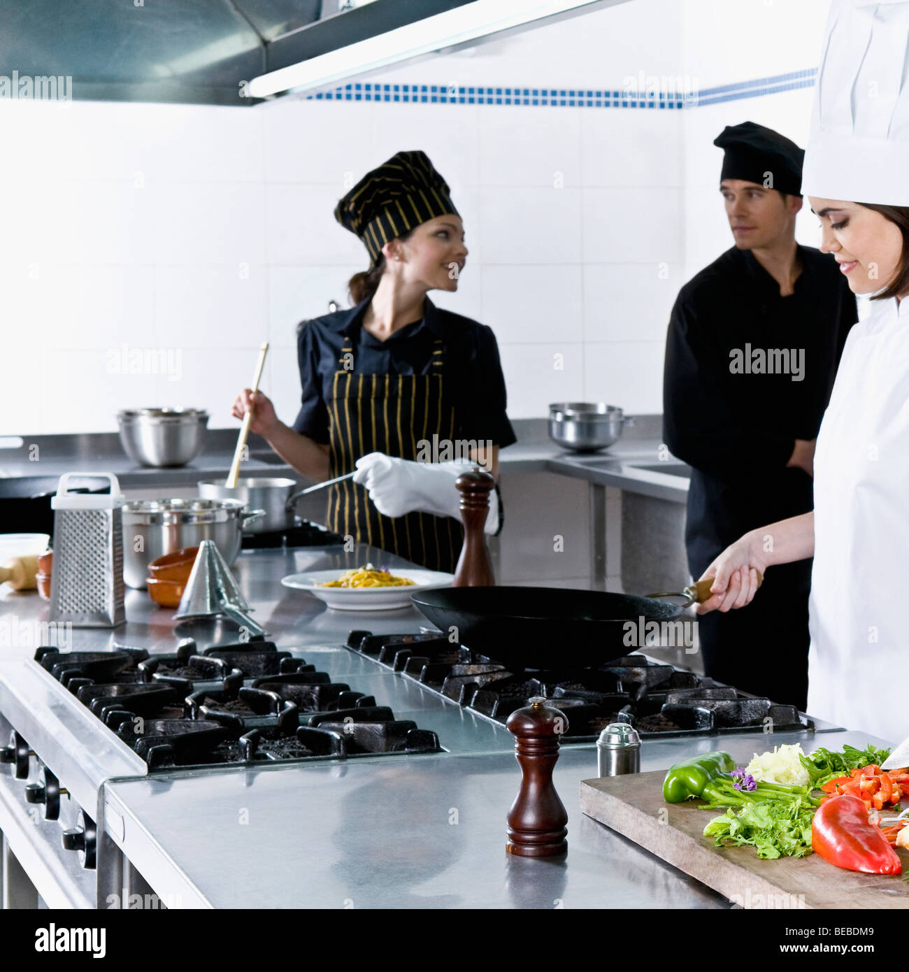 Chefs cooking food in the kitchen Stock Photo - Alamy