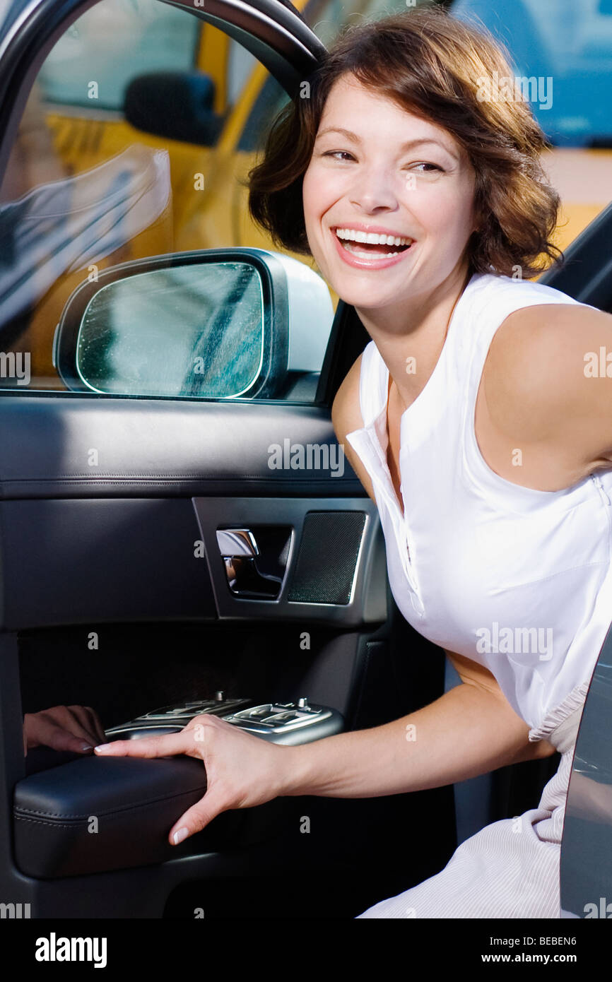 Woman getting out of a car and smiling, Biltmore Hotel, Coral Gables ...