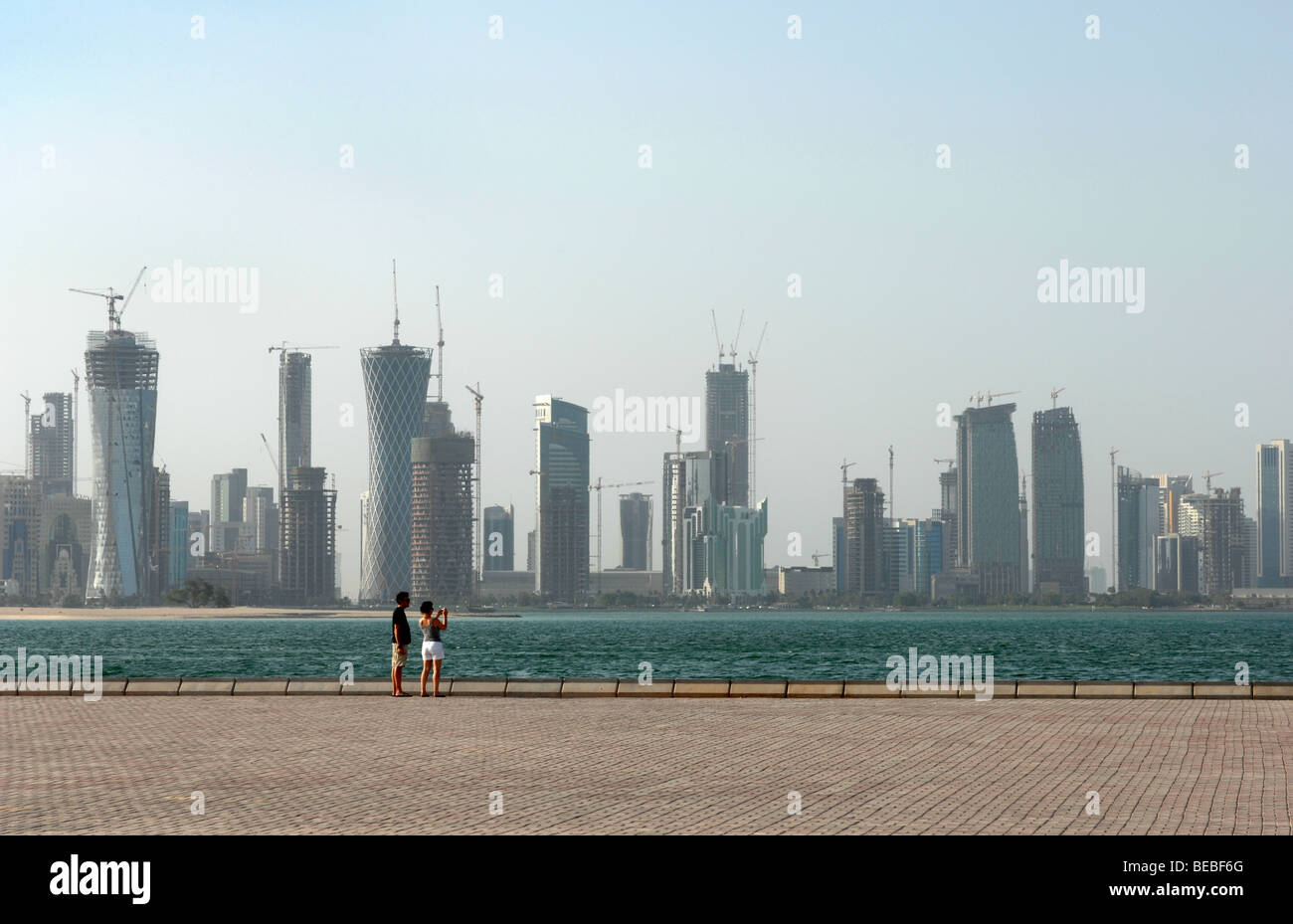 Young Couple photographing Doha City Skyline Stock Photo - Alamy