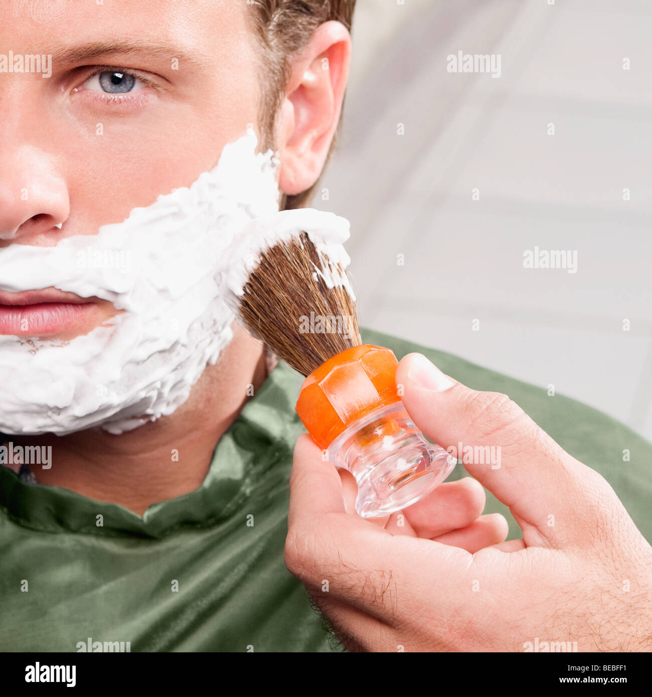 Man getting shaved in a salon Stock Photo - Alamy