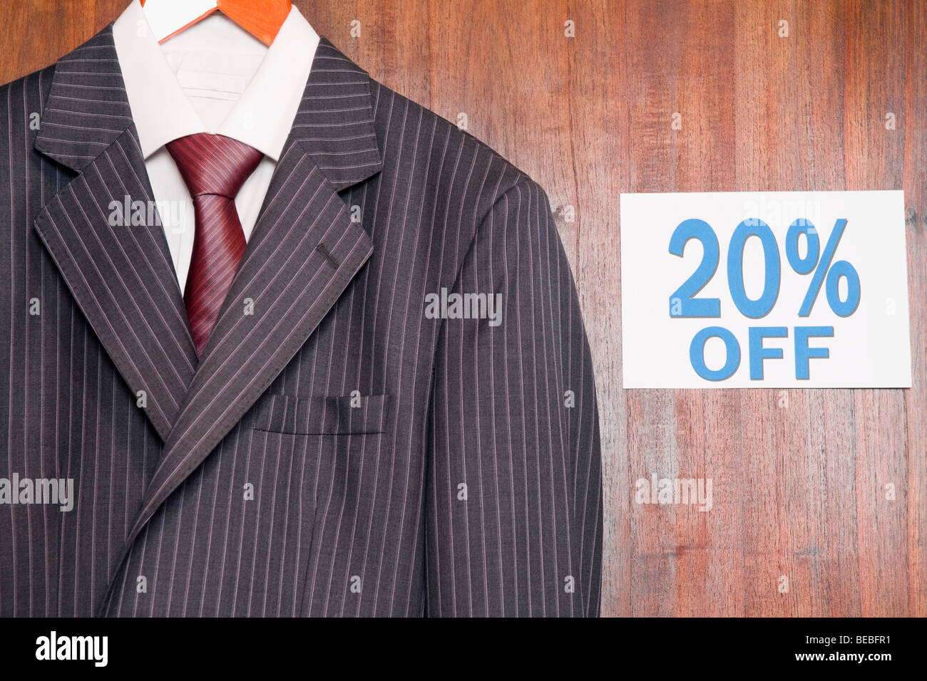 Suit displayed with a Discount sign at a clothing store Stock Photo - Alamy