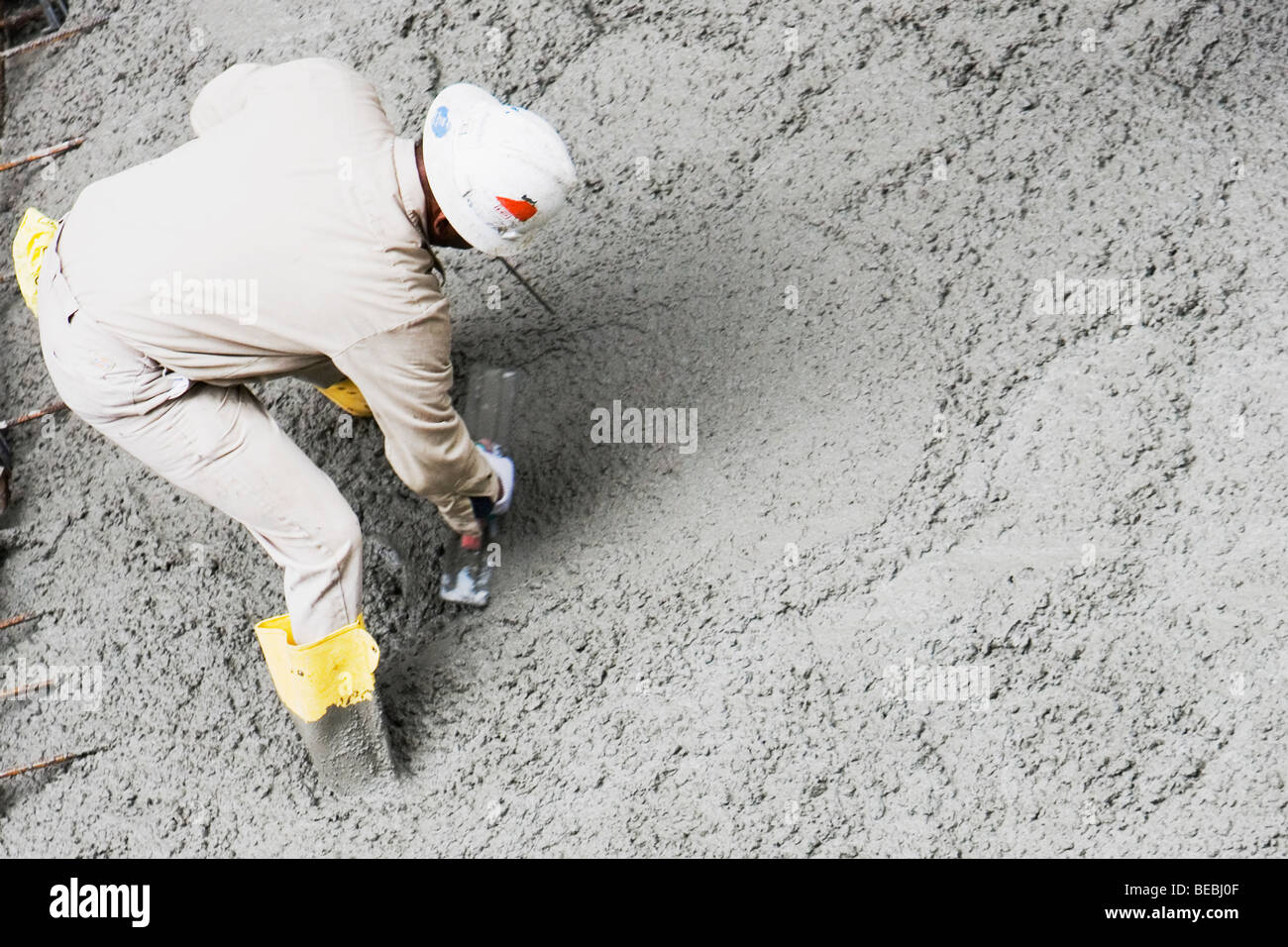 High angle view of a construction worker working at a construction site ...