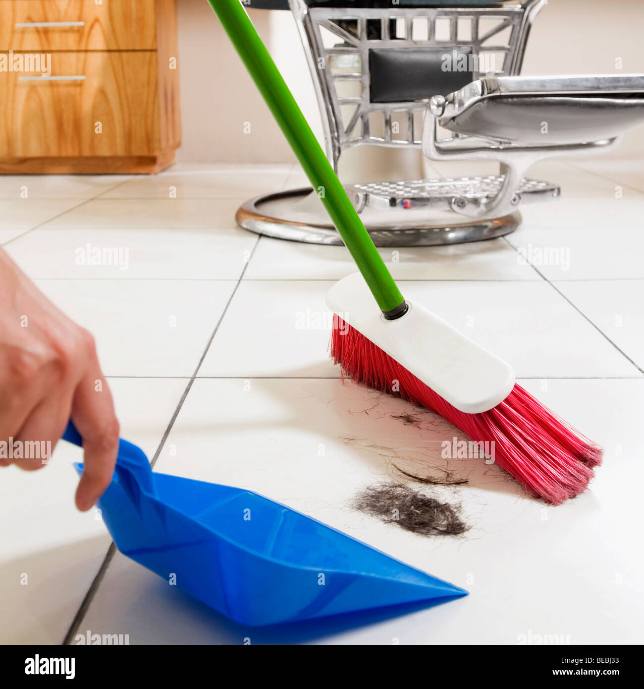 Barber cleaning floor hairdresser salon hi-res stock photography and ...