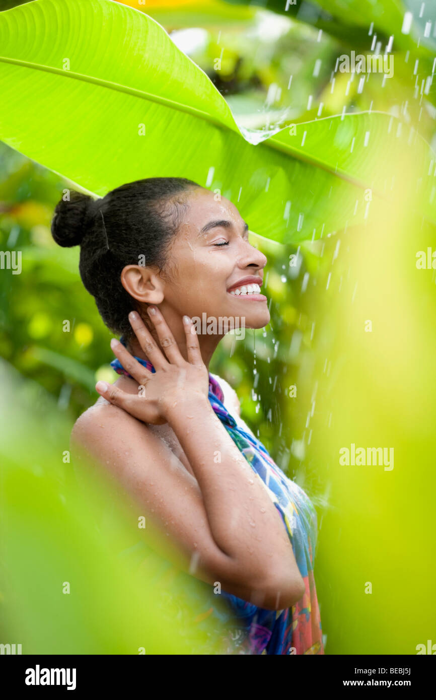 Teenage girl enjoying rain Stock Photo - Alamy