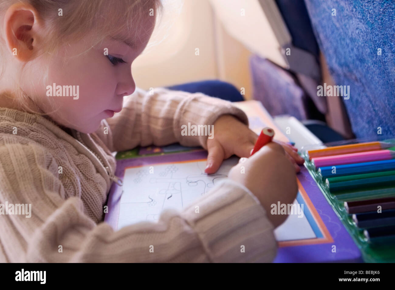 Baby girl coloring a picture Stock Photo - Alamy
