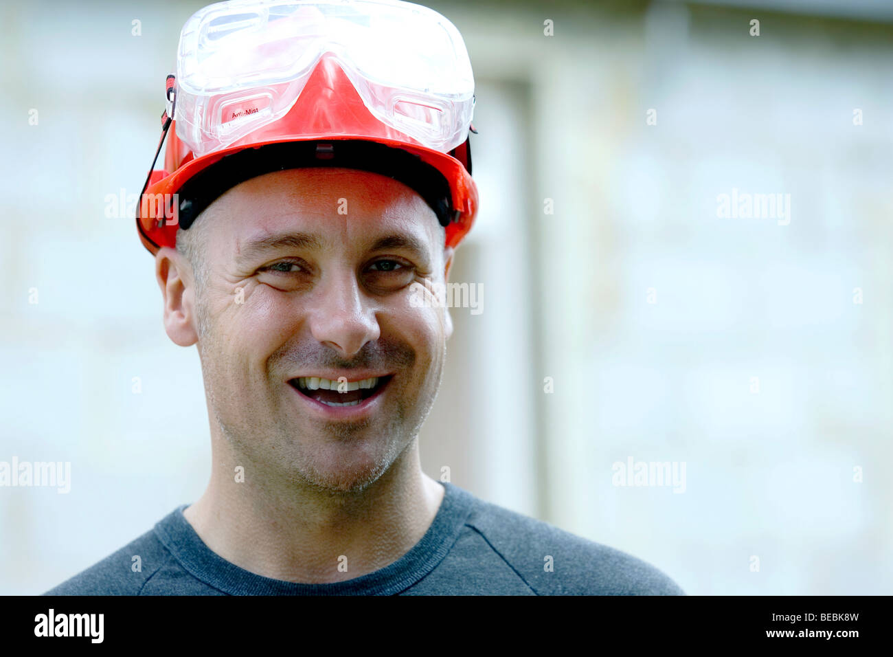 Portrait of a builder with hard hat Stock Photo - Alamy