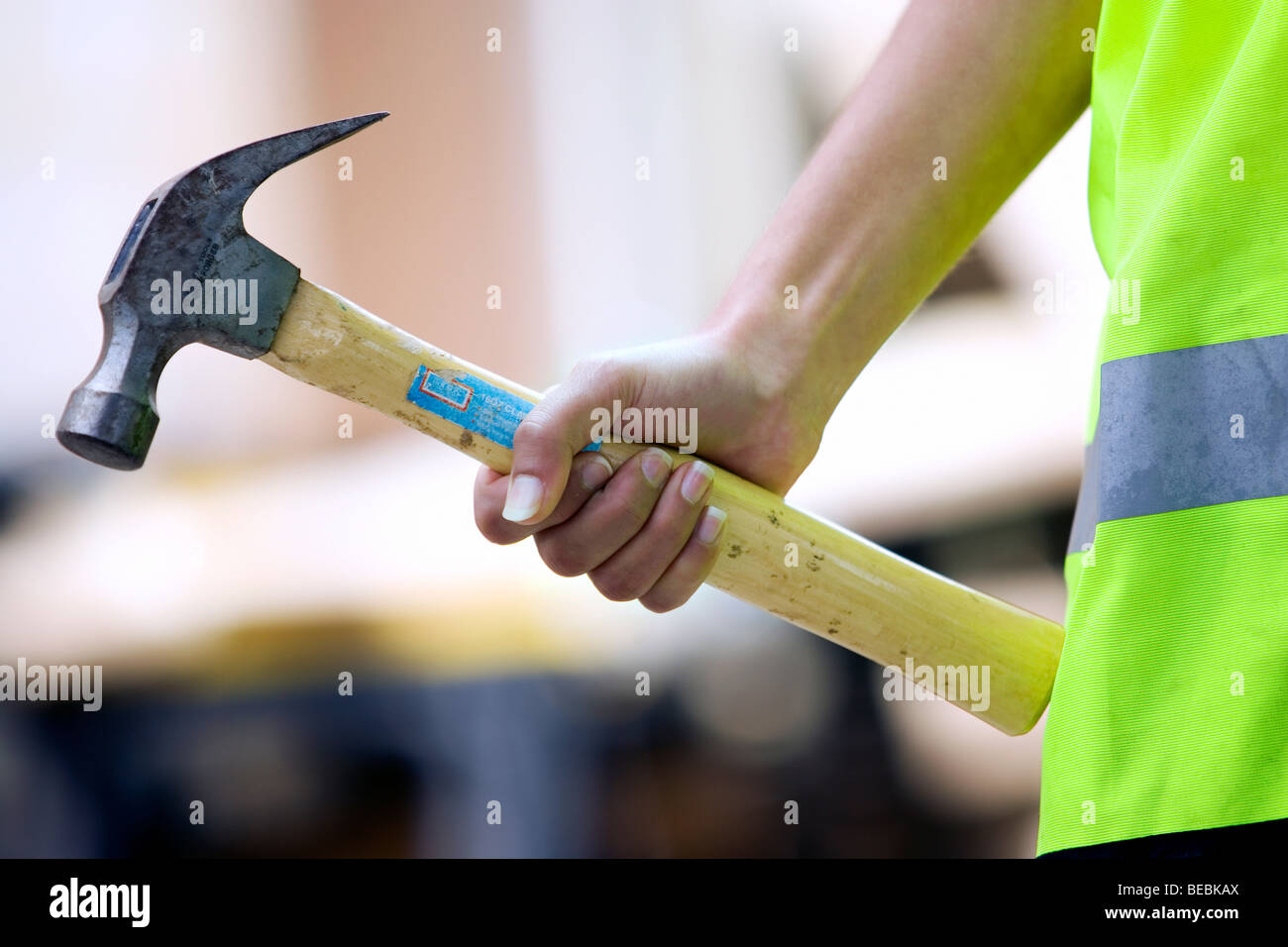 Detail of a woman's hand with hammer Stock Photo - Alamy