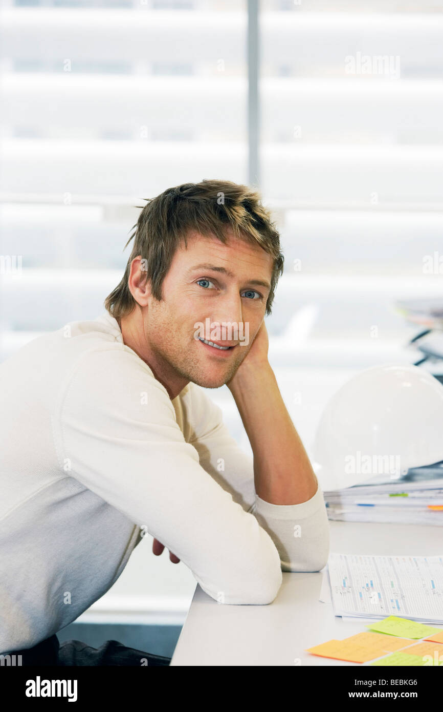 Young happy executive in office Stock Photo - Alamy