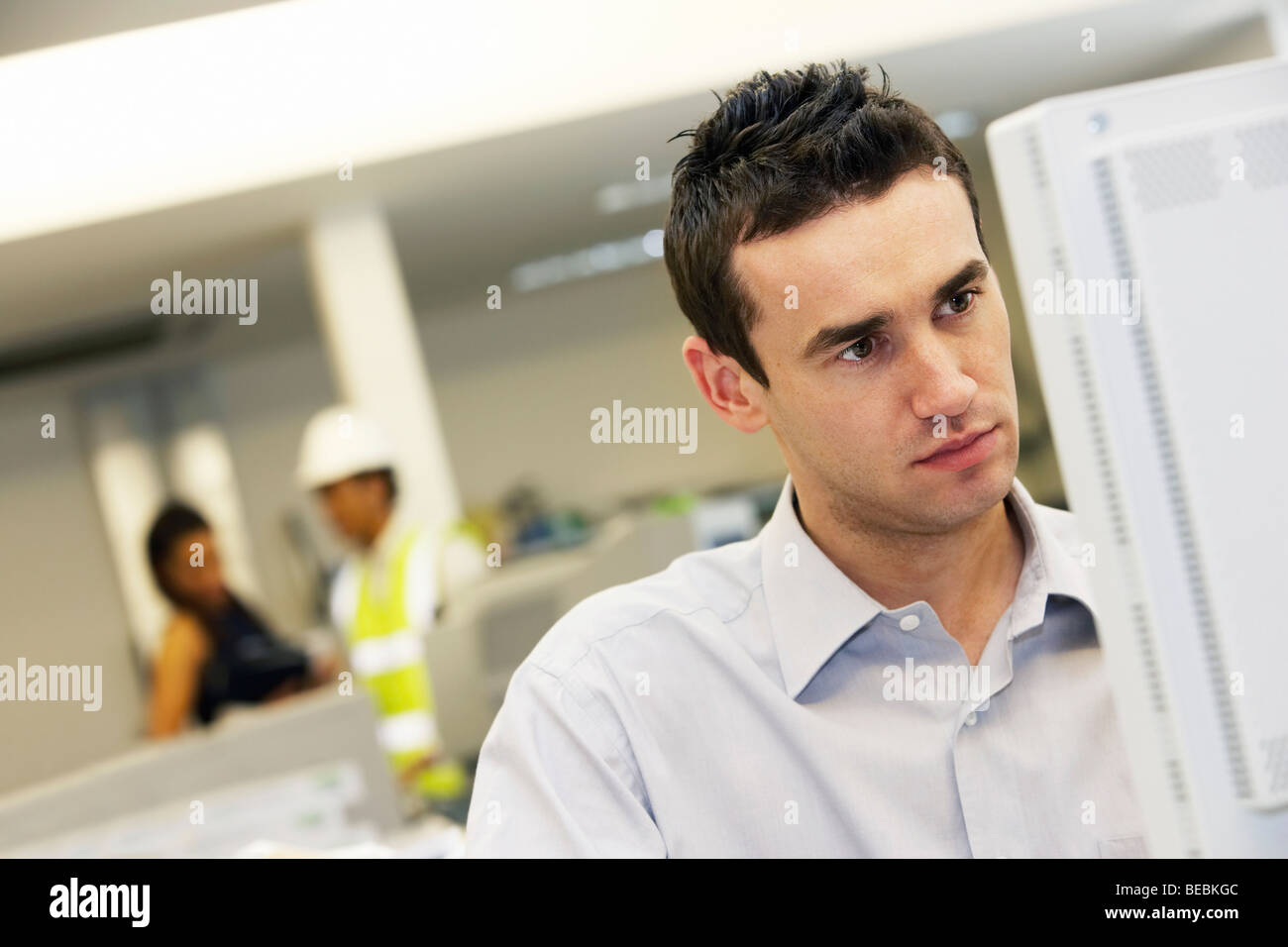 Man working on computer Stock Photo - Alamy