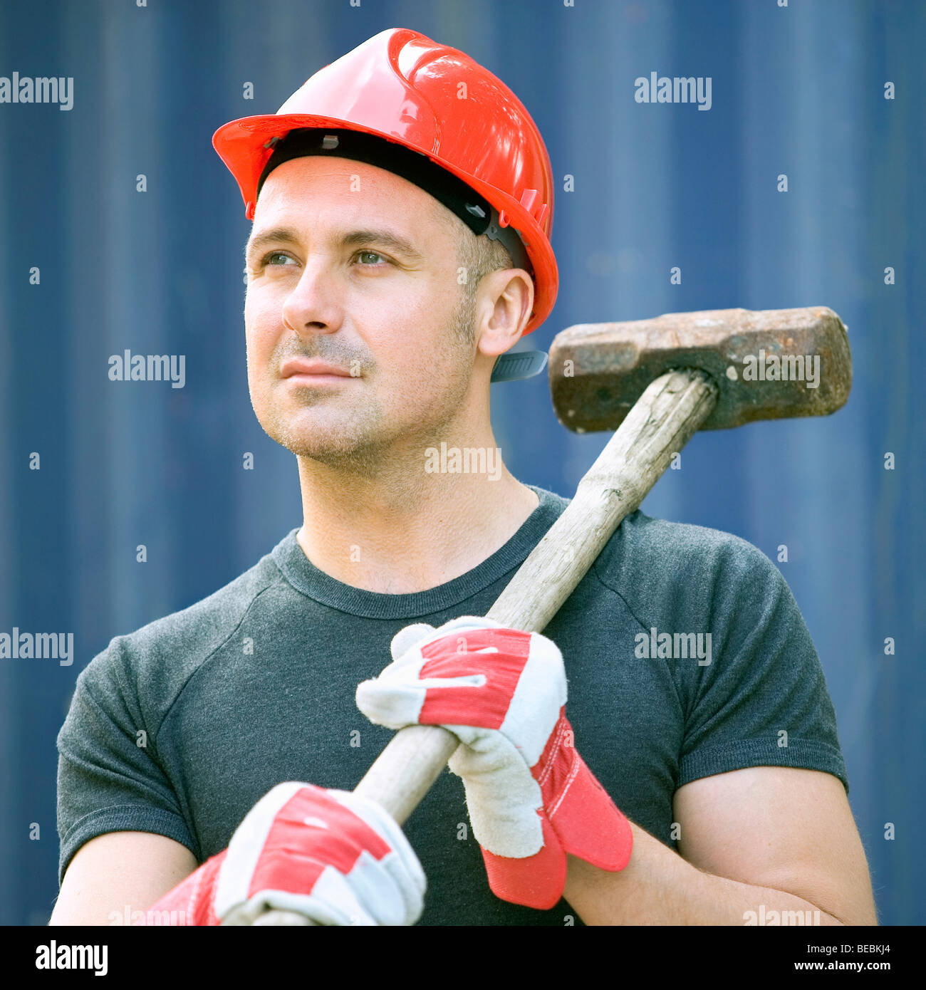 Builder with sledge hammer Stock Photo - Alamy