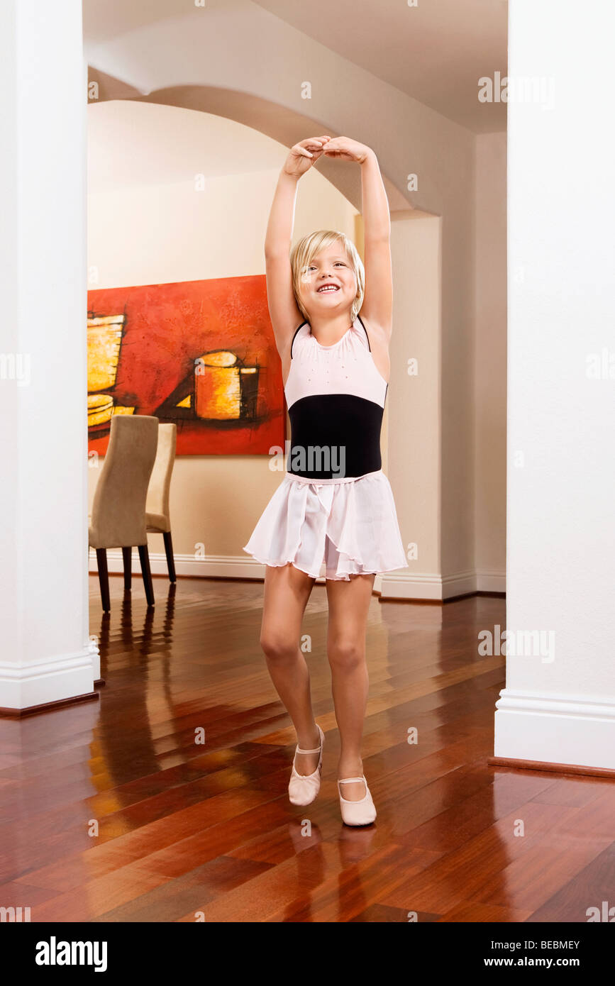 Girl practicing ballet in a house Stock Photo - Alamy