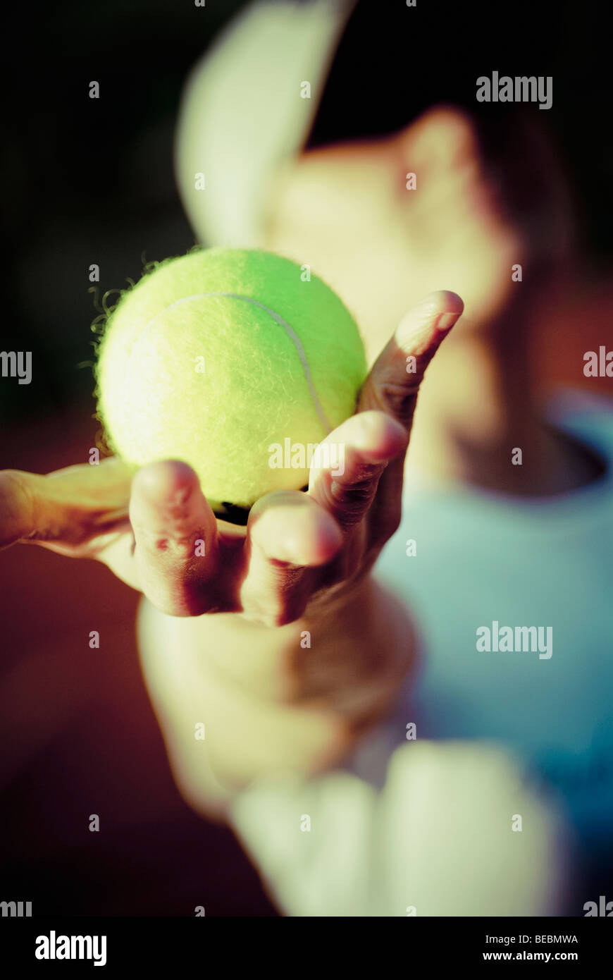 Hand holding yellow tennis hi-res stock photography and images - Alamy