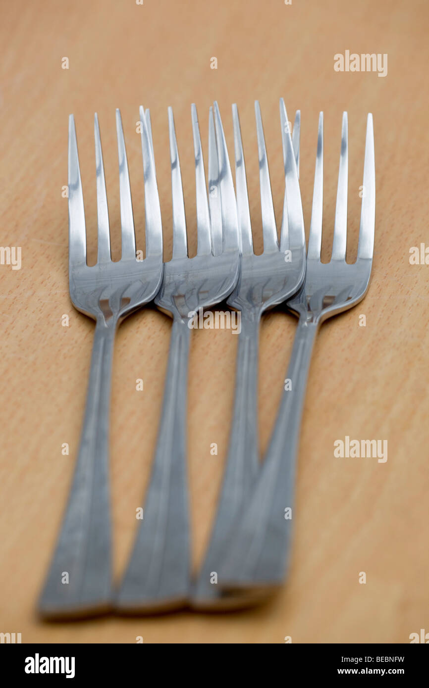 forks on a table Stock Photo - Alamy